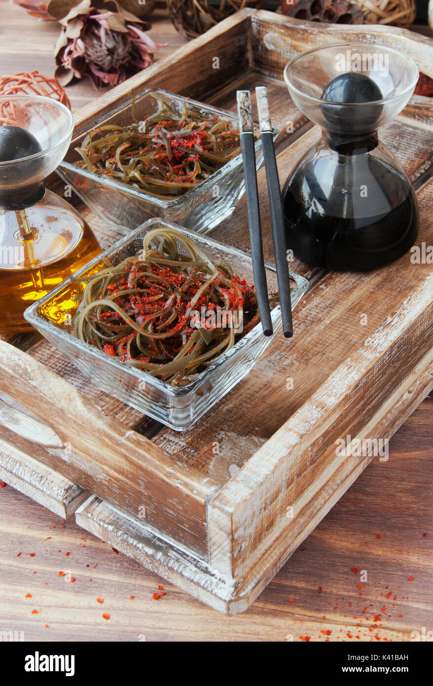 seaweed and spices, chopsticks, on an open wooden table, selective ...