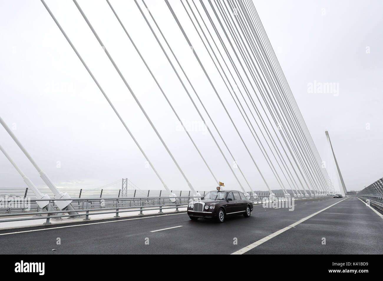 Queen Elizabeth II and the Duke of Edinburgh are driven across the ...