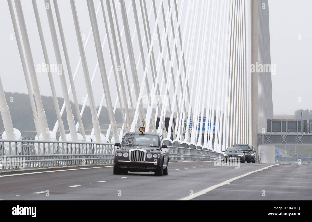 Queen Elizabeth II and the Duke of Edinburgh are driven across the ...