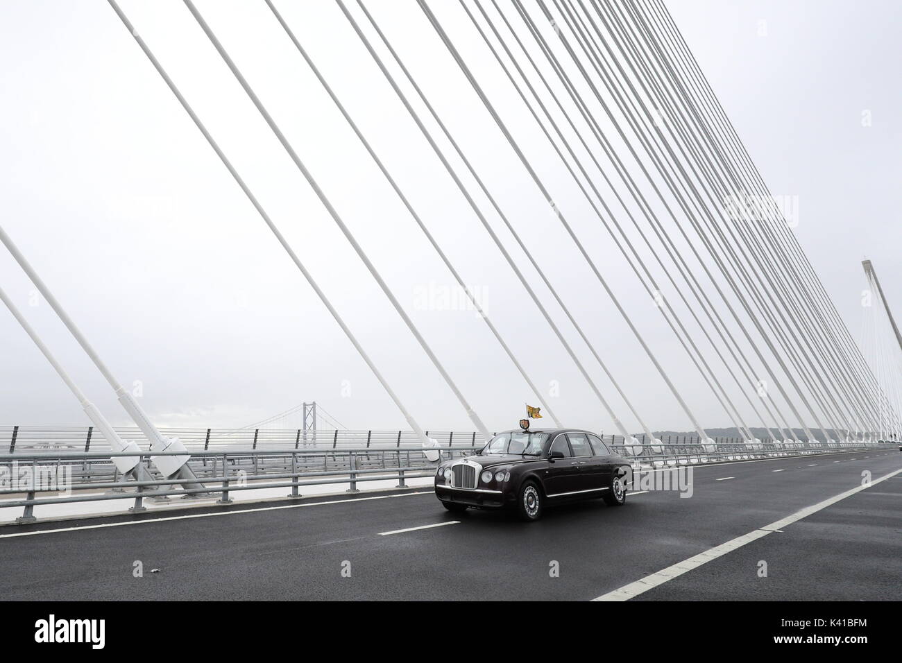 Queen Elizabeth II and the Duke of Edinburgh are driven across the ...
