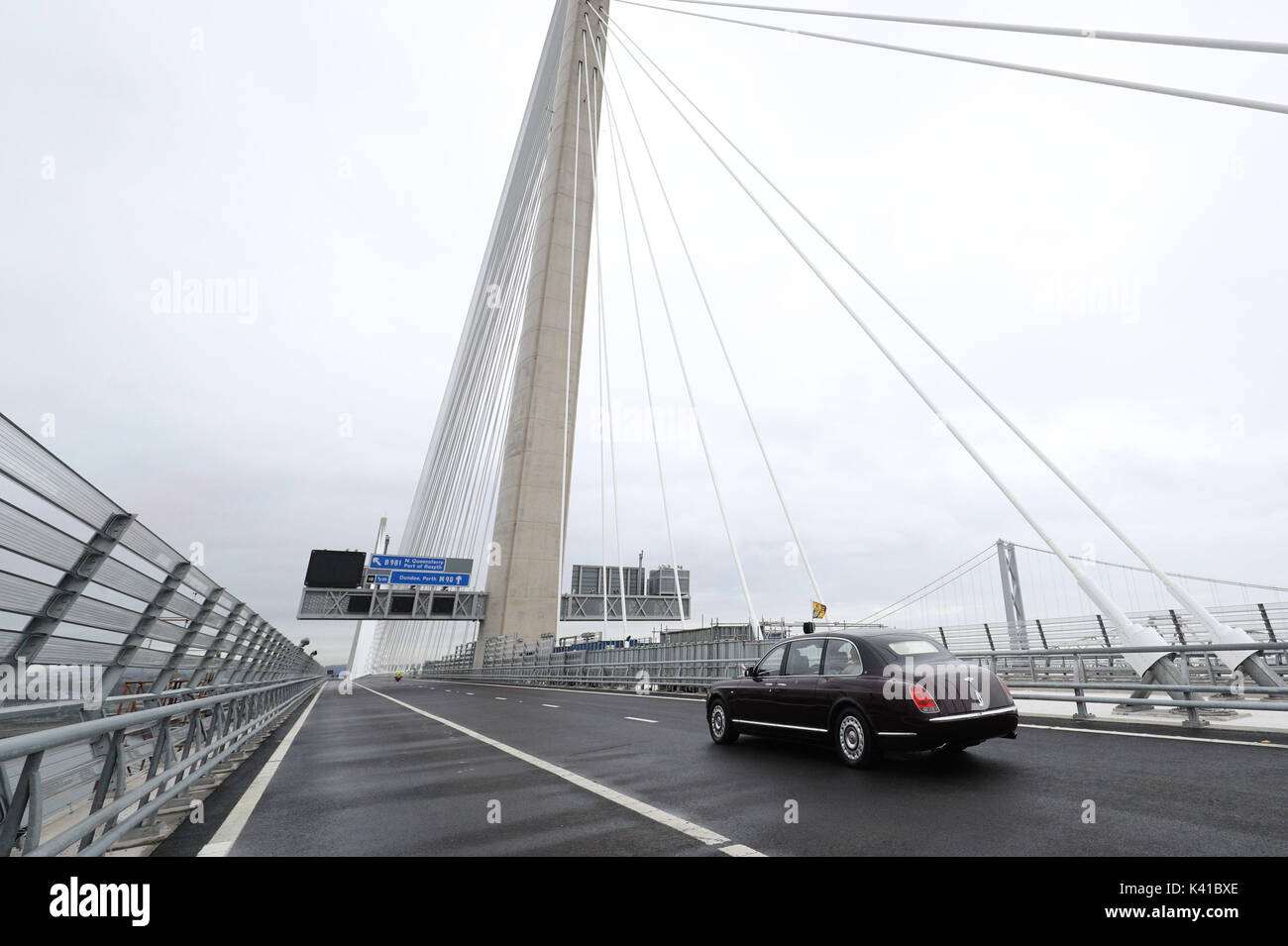 Queen Elizabeth II and the Duke of Edinburgh are driven across the ...