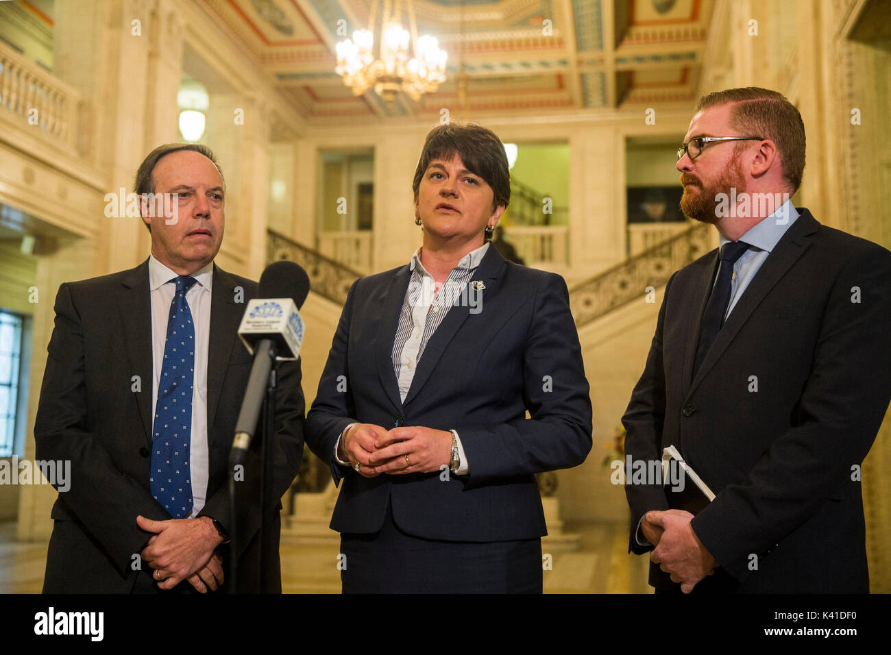 DUP leader Arlene Foster speaks alongside her party colleagues Nigel ...