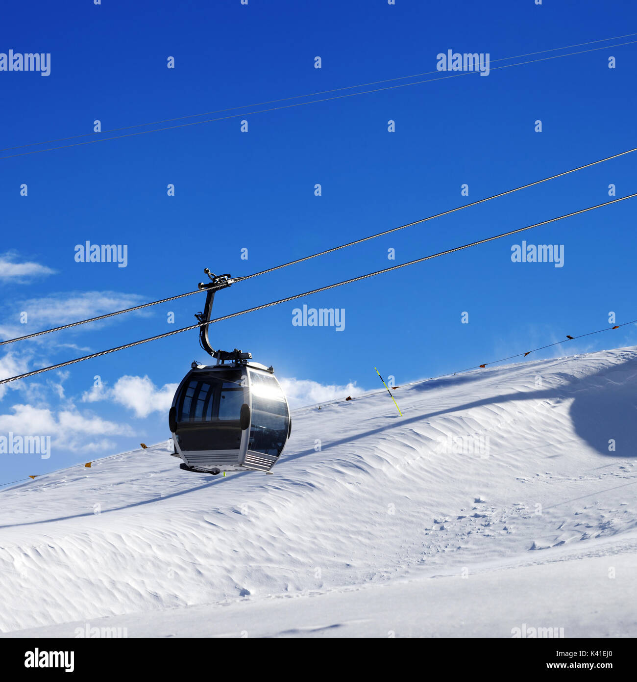 Gondola lift and snow slope on ski resort at sun wind winter day Stock ...