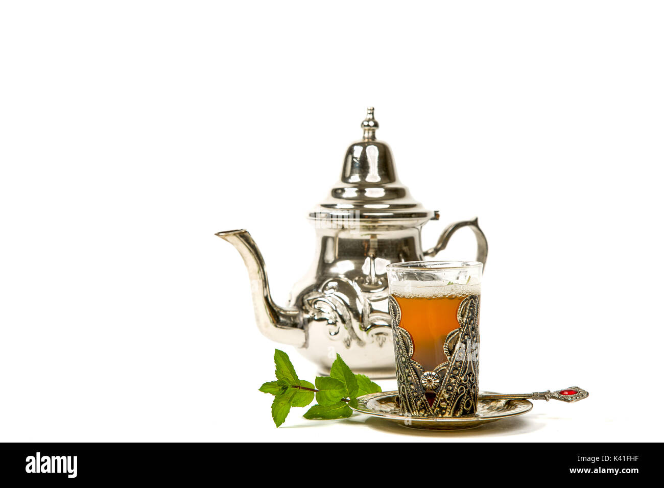 True Moroccan mint tea in the original cup and teapot on the white ...