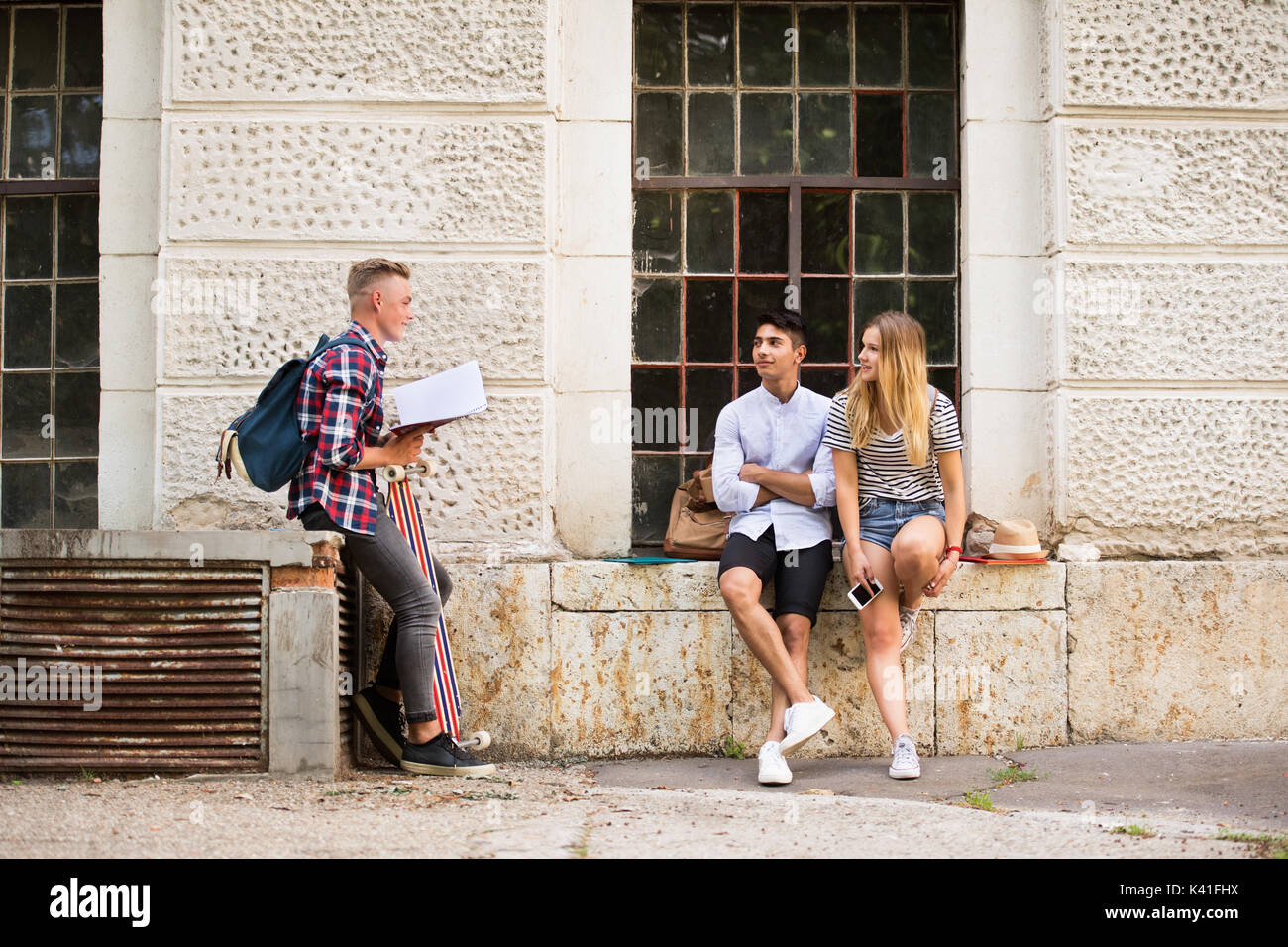 Group of students in front of university studying, having fun Stock ...