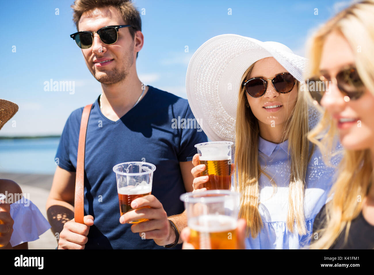 A photo of group of friends partying outside and drinking beer Stock ...