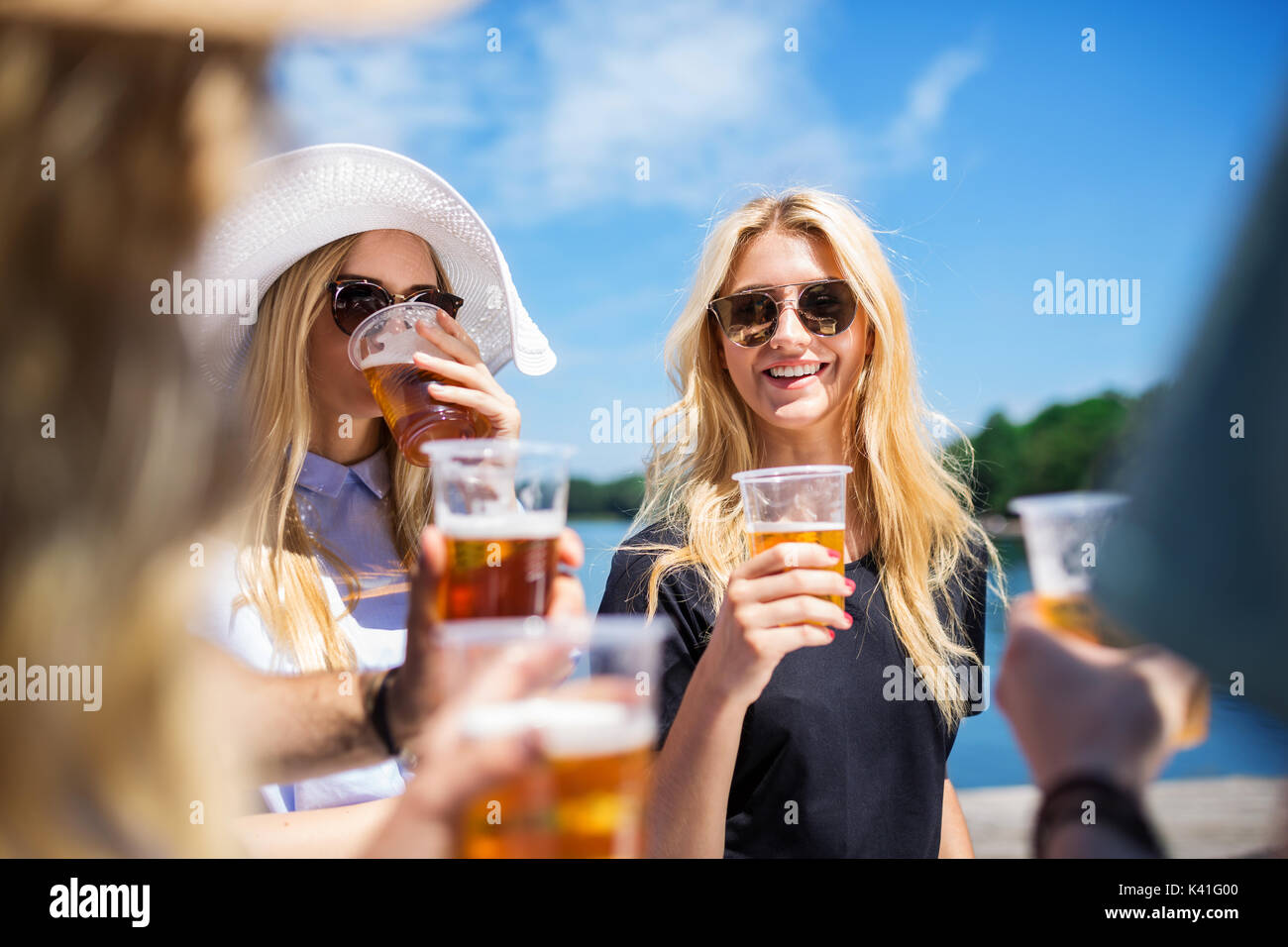 Blonde girl drinking beer hi-res stock photography and images - Alamy