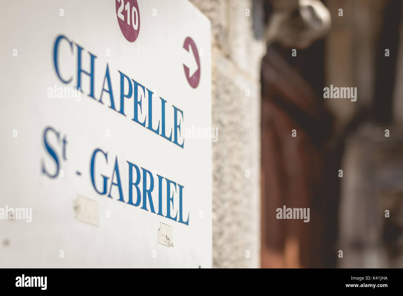 sign indicates the direction of the chapel Saint GABRIEL in Lourdes in ...
