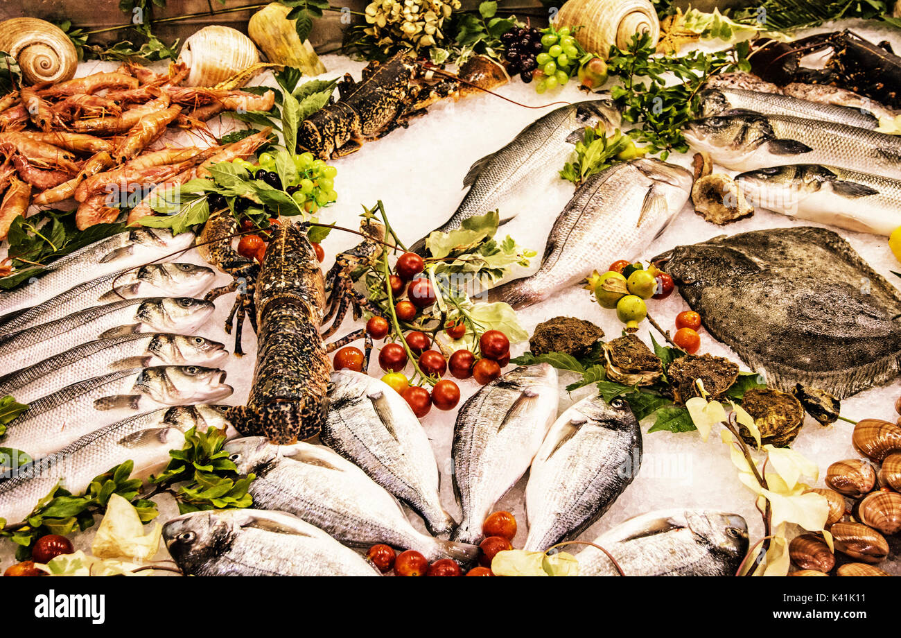 Fresh raw seafoods on counter in restaurant. Food theme. Mediterranean ...
