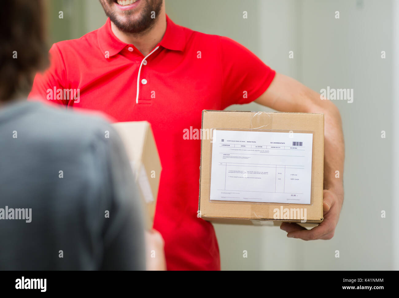 happy delivery man with parcel box and customer Stock Photo - Alamy