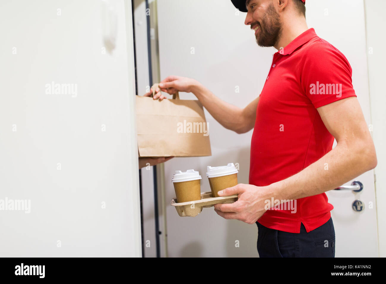 Man receiving food delivery hi-res stock photography and images - Alamy