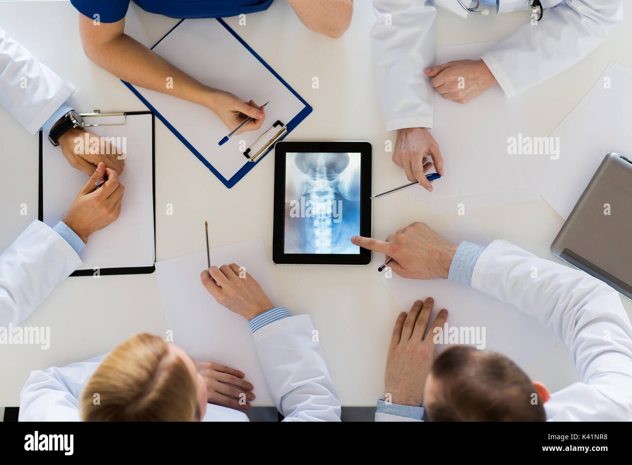 doctors with spine x-ray on tablet pc computer Stock Photo - Alamy