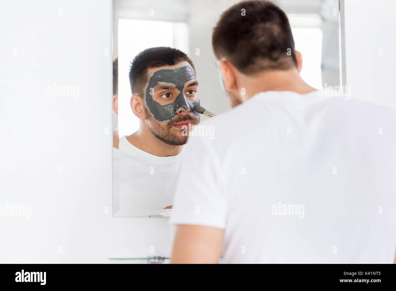 Applying clay face mask hi-res stock photography and images - Alamy