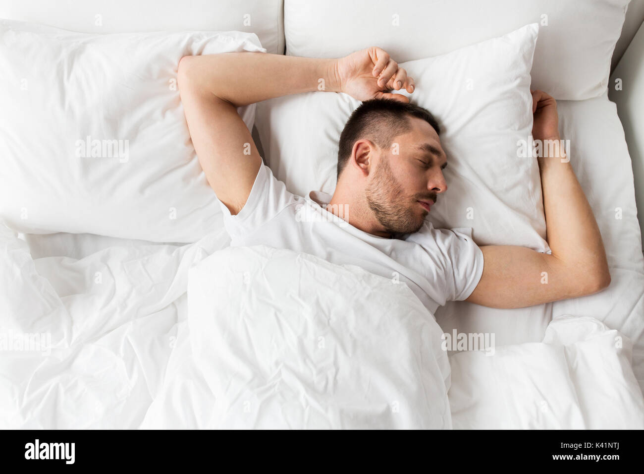 Man sleeping in bed hi-res stock photography and images - Alamy