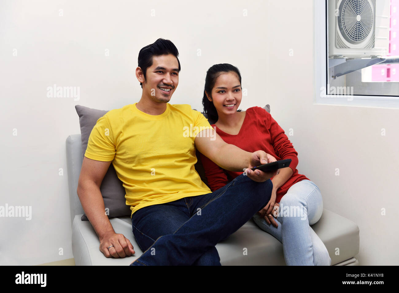 Asian couple watching tv lifestyle hi-res stock photography and images - Alamy