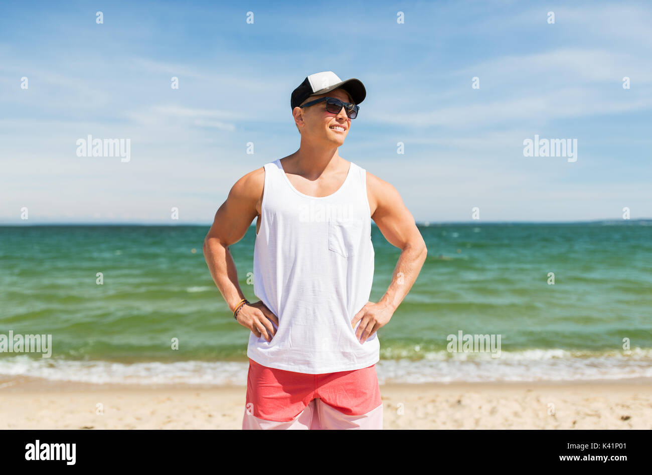 Handsome smiling guy beach hi-res stock photography and images - Alamy