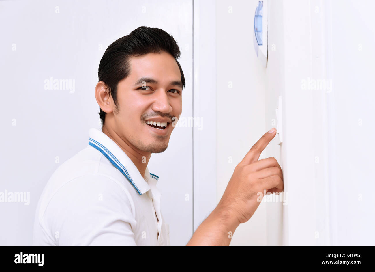 Light switch and finger hi-res stock photography and images - Alamy