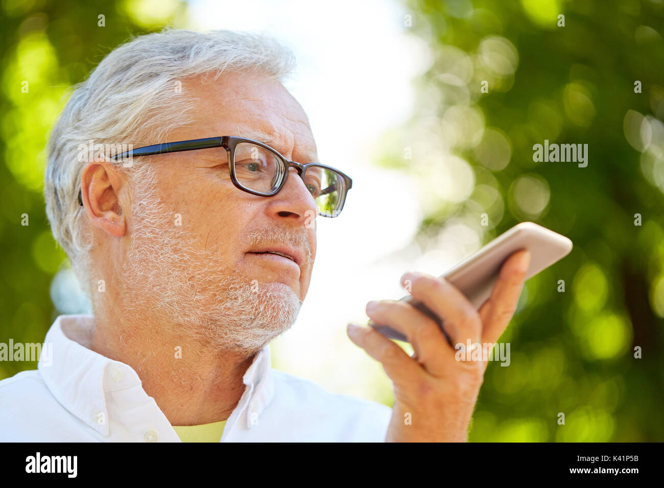 Senior grey haired man using hi-res stock photography and images - Alamy