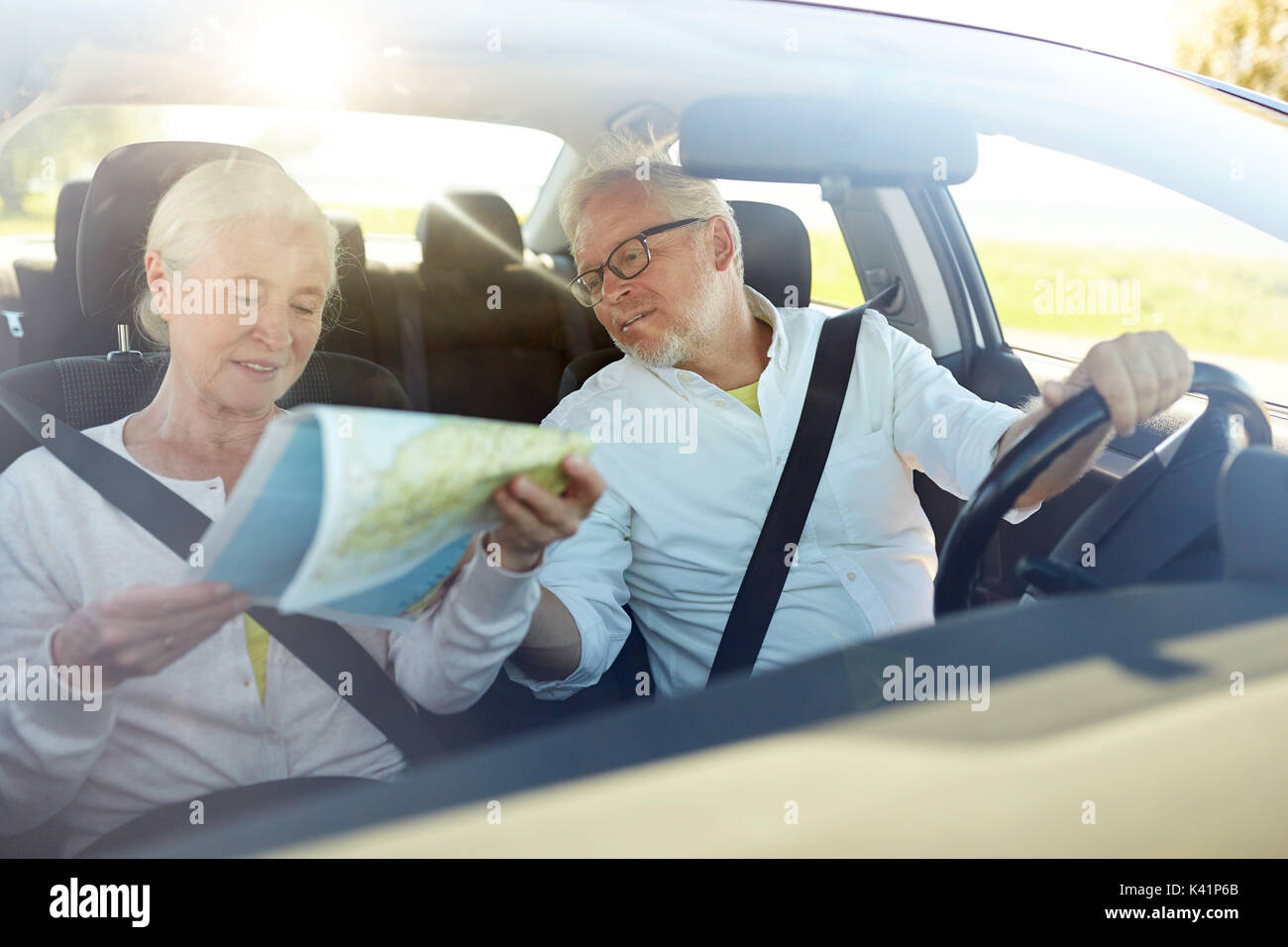 Senior man looking in road map hi-res stock photography and images - Alamy
