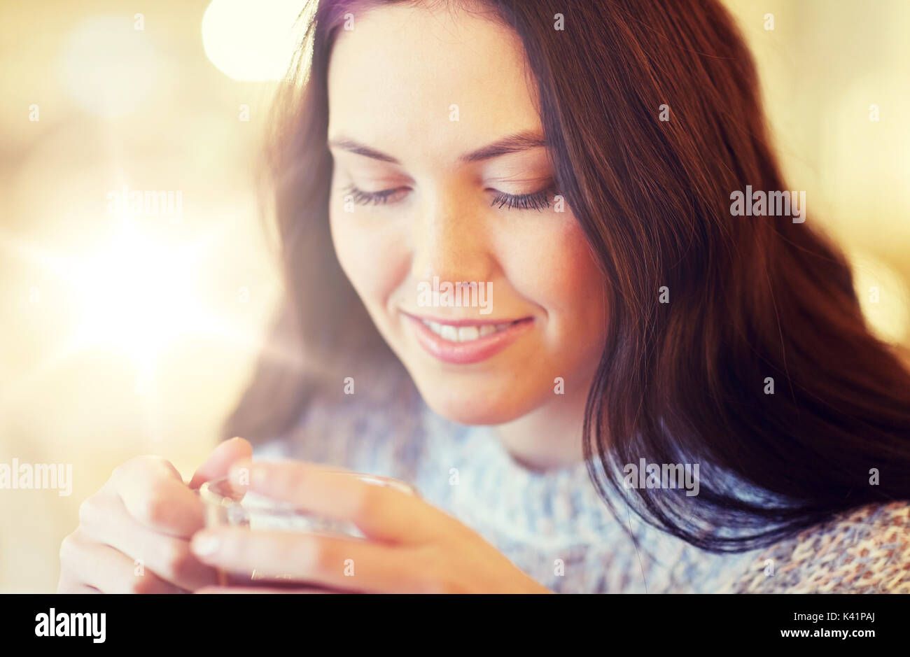 Smiling drinking tea hi-res stock photography and images - Alamy