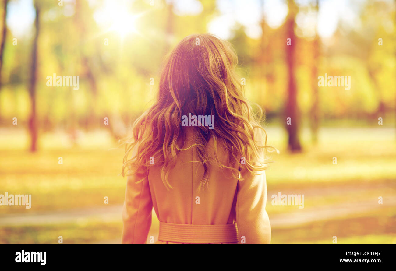beautiful young woman walking in autumn park Stock Photo - Alamy
