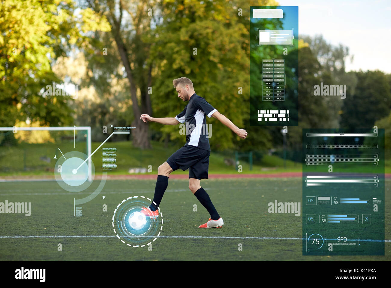 soccer player playing with ball on football field Stock Photo - Alamy