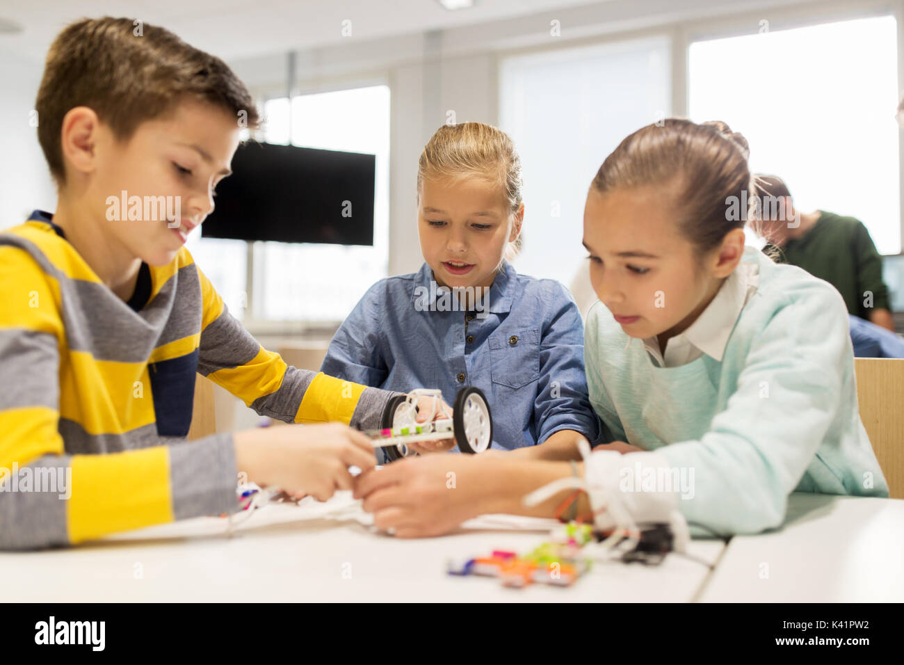 happy children building robots at robotics school Stock Photo - Alamy