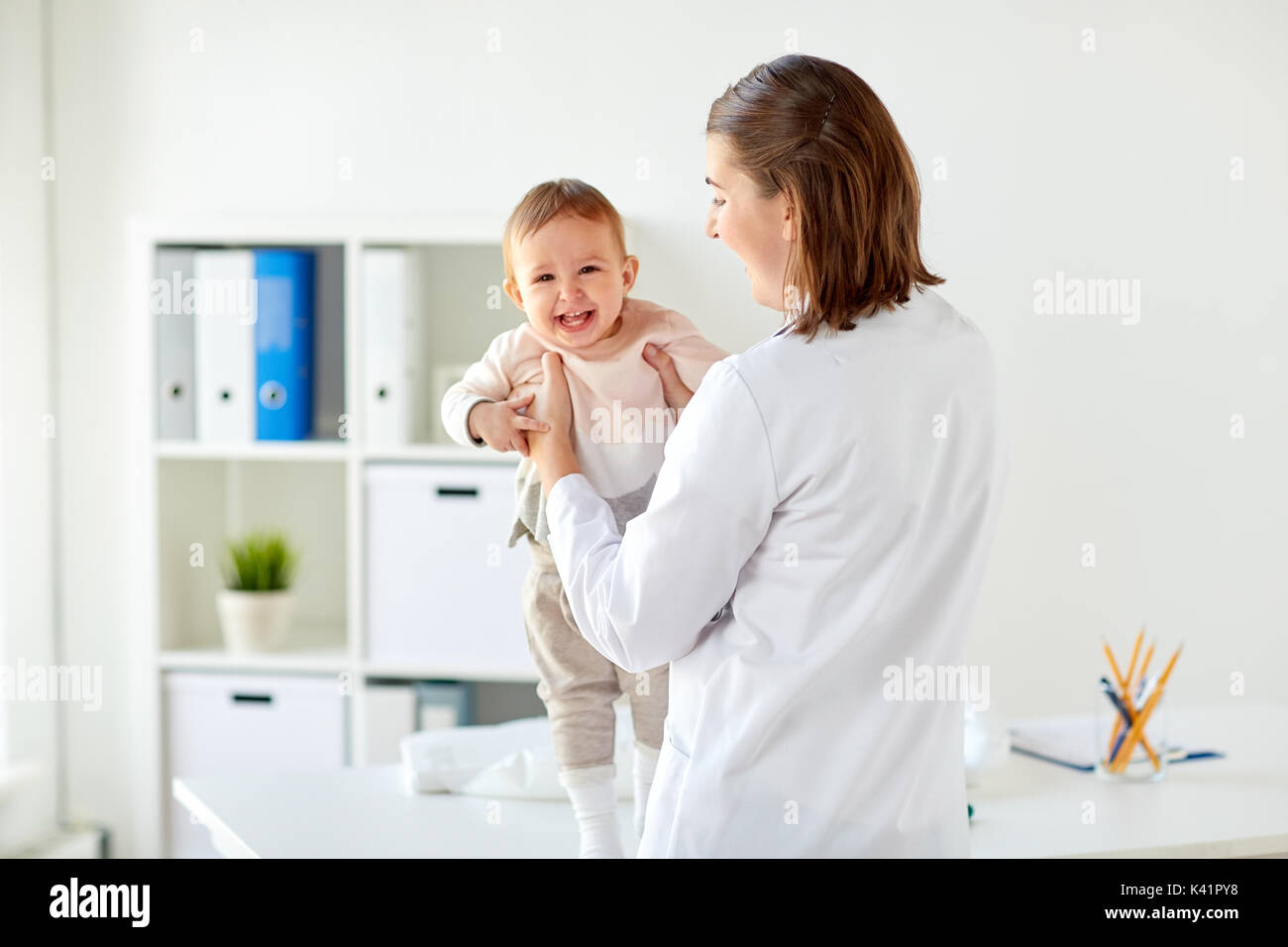 Baby and doctor hi-res stock photography and images - Alamy