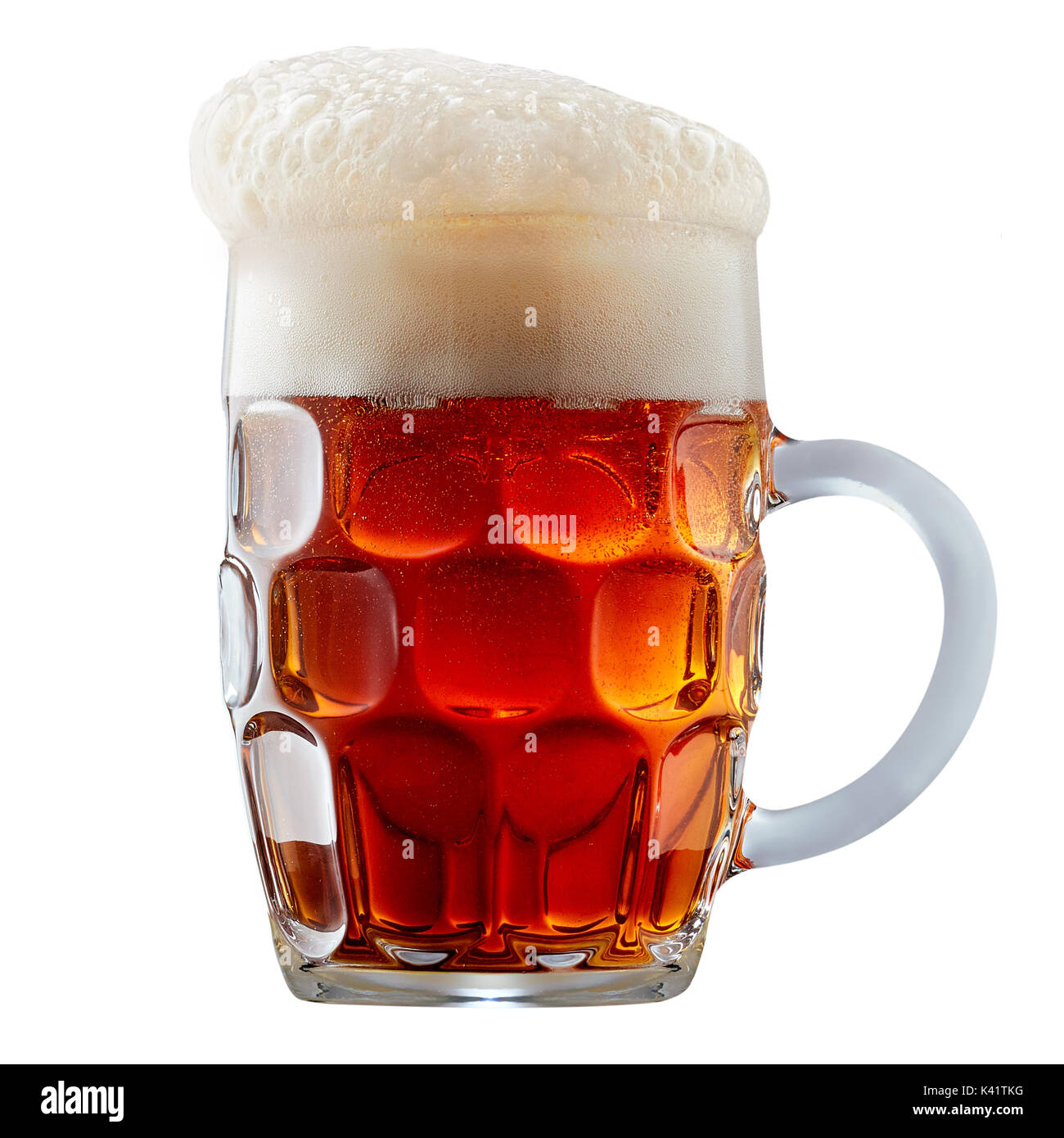 Mug of frosty dark red beer with foam Stock Photo - Alamy