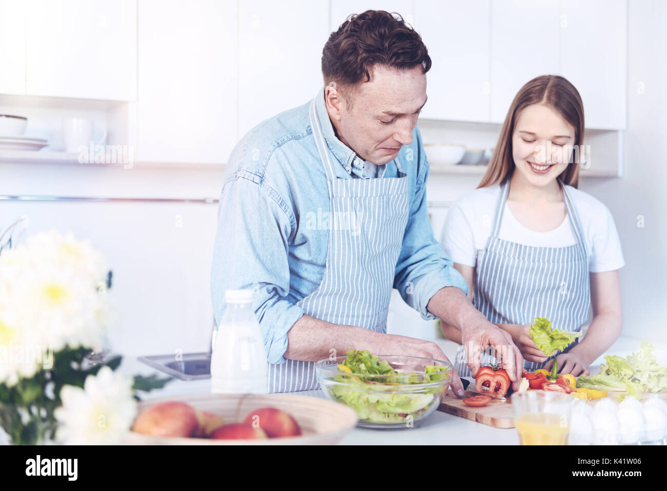 Daughter and dad enjoying cooking together Stock Photo - Alamy