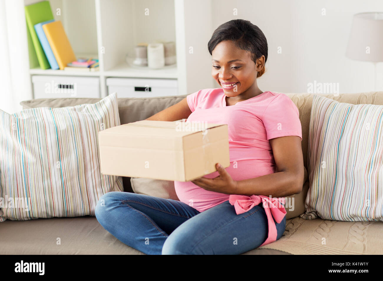 happy pregnant woman with parcel box at home Stock Photo - Alamy