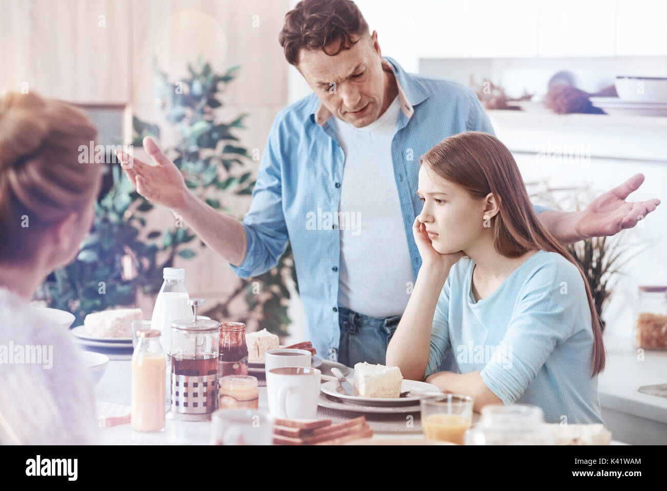 Concerned father getting emotional while yelling his teenage daughter ...