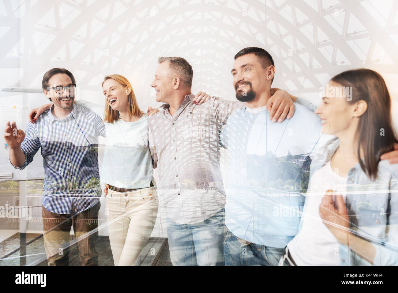Cheerful office workers bonding to each other Stock Photo - Alamy