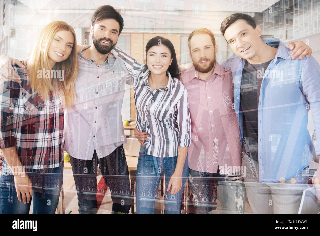Positive group of people standing in the office Stock Photo - Alamy