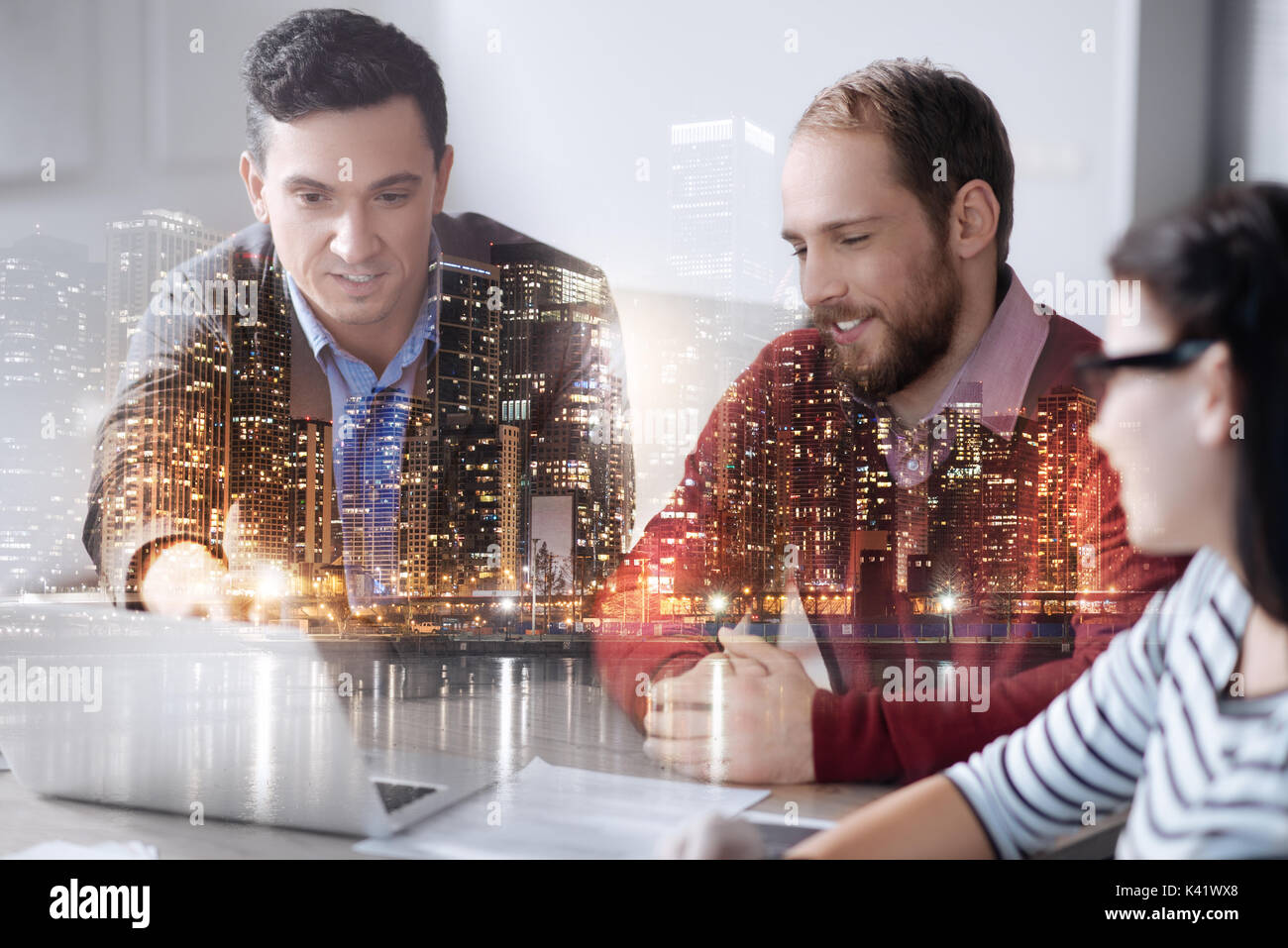 Positive professional man discussing a new project with his colleagues ...