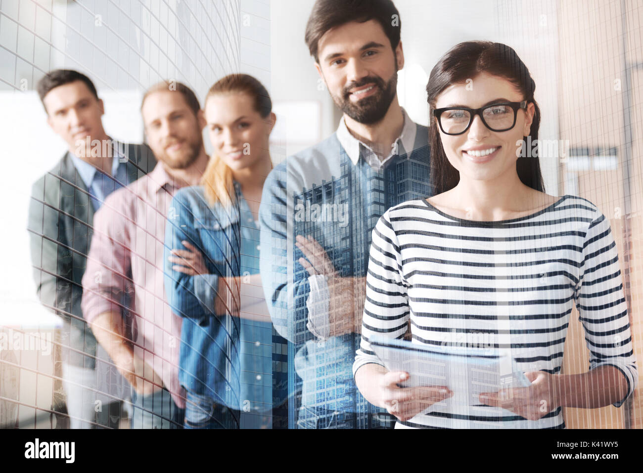 Positive office workers feeling ready to work Stock Photo - Alamy