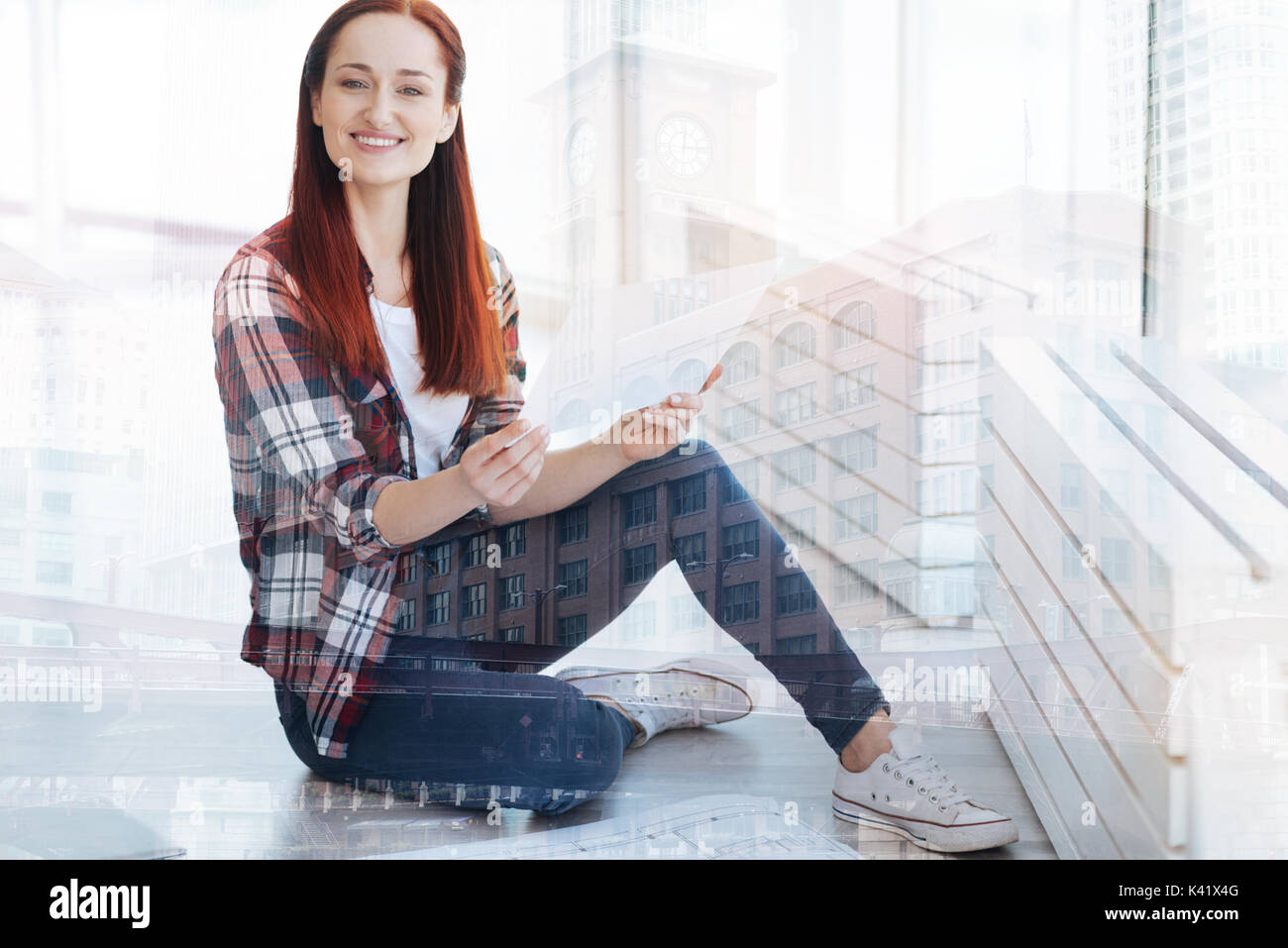 Cheerful worker satisfied with the results of her project Stock Photo ...