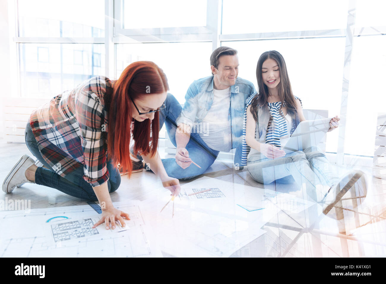 Talented designer making measurements on the floor Stock Photo - Alamy