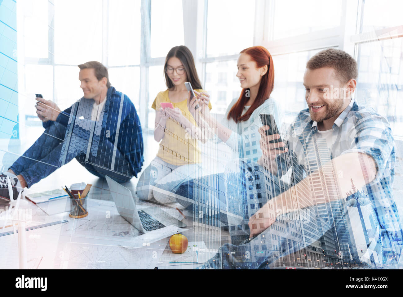 Smart coworkers using mobile phones Stock Photo - Alamy