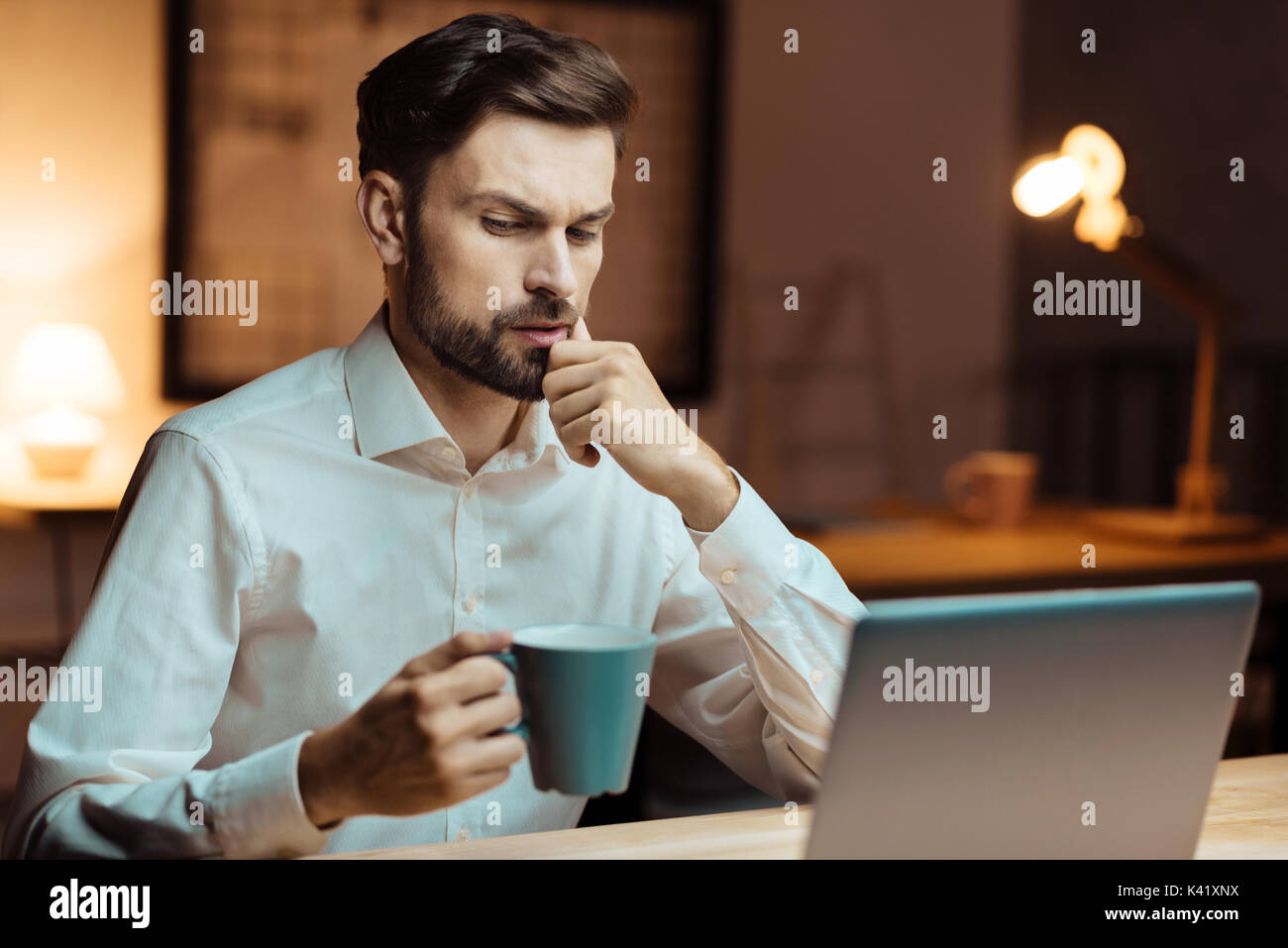 Thoughtful office worker having idea Stock Photo - Alamy