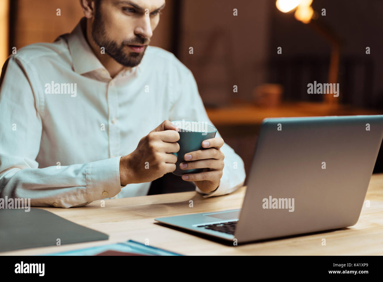 Confident male person while having break Stock Photo - Alamy