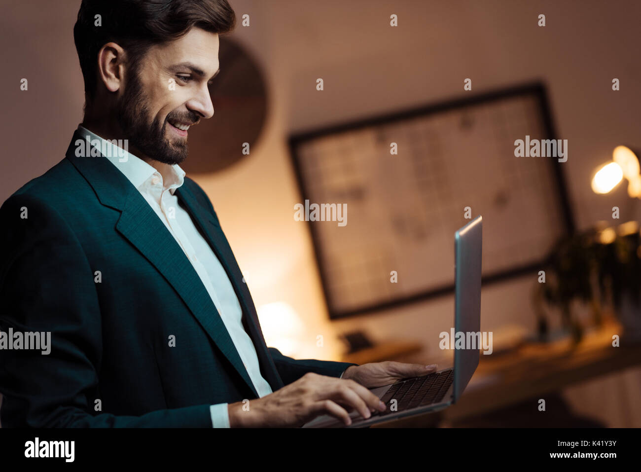Profile photo of delighted man that typing message Stock Photo - Alamy