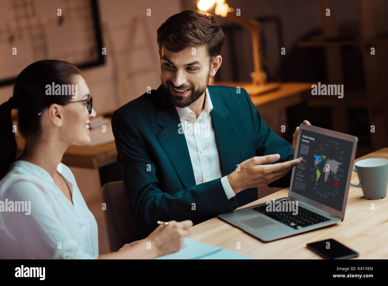 Positive assistant making important notes Stock Photo - Alamy