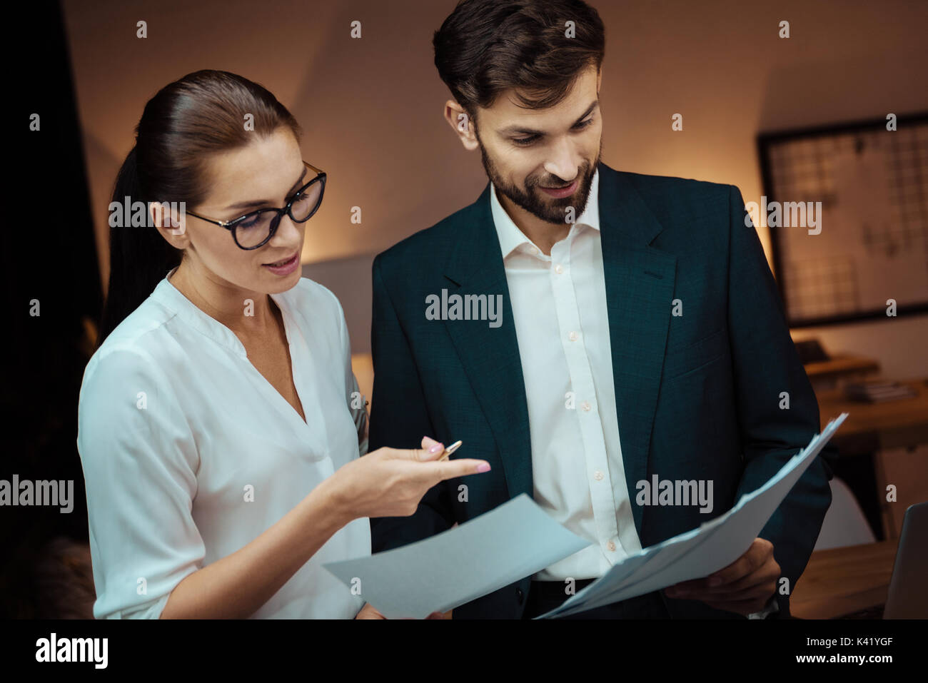 Attentive professional colleagues checking hi-res stock photography and ...