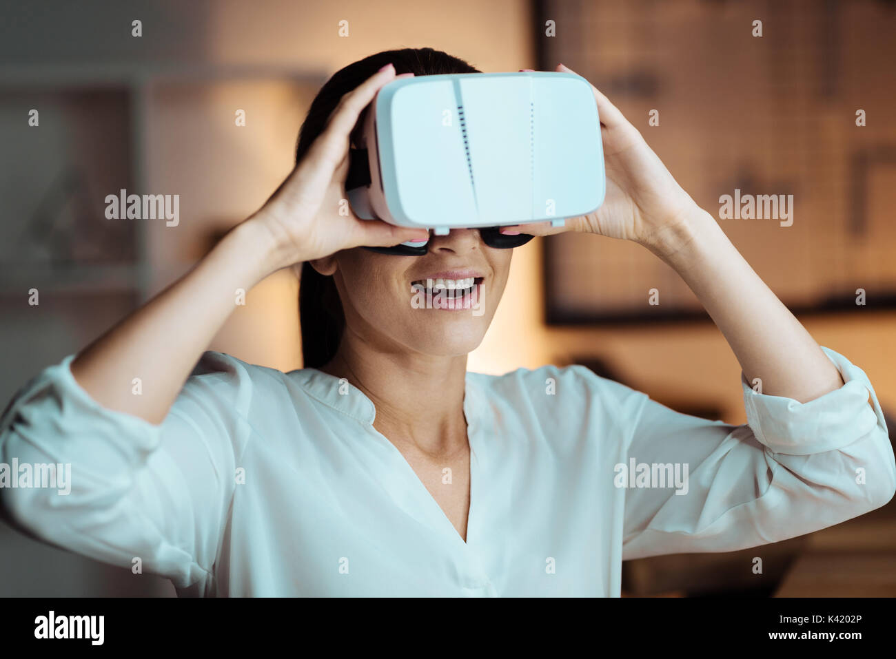 Positive delighted female wearing virtual mask Stock Photo - Alamy