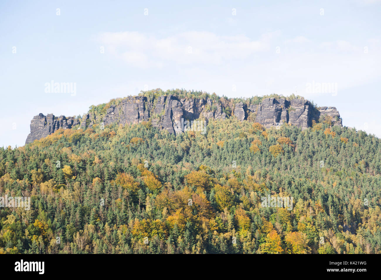 A large high flat rock mountain in the middle of a green boundless ...