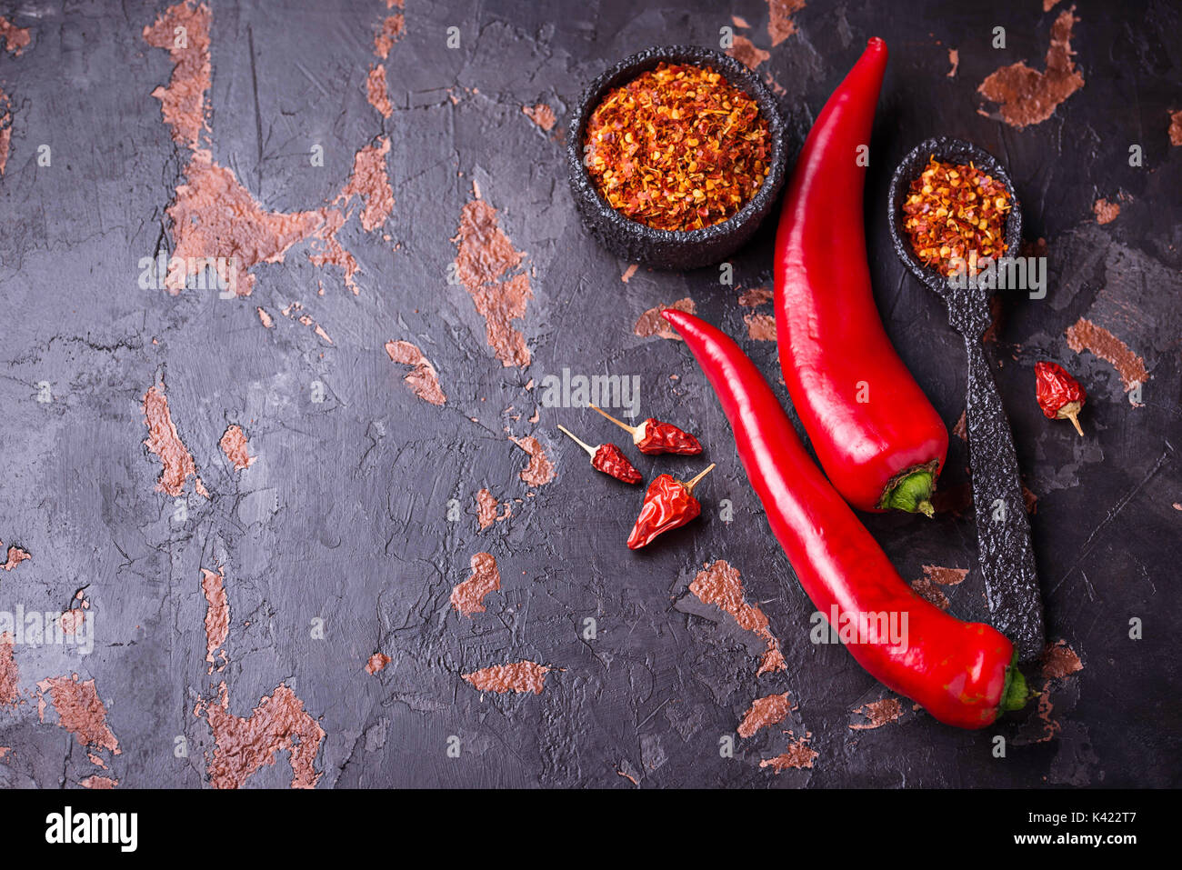 Red chili pepper on old rusty background Stock Photo - Alamy