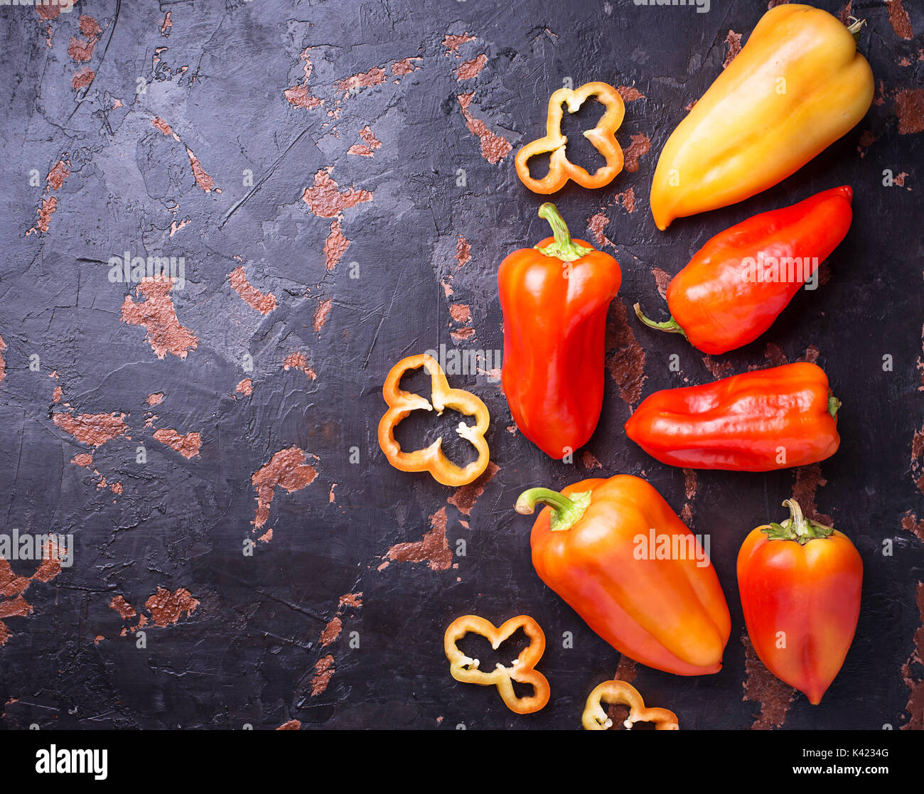 Sweet bulgarian pepper on dark rusty background Stock Photo - Alamy