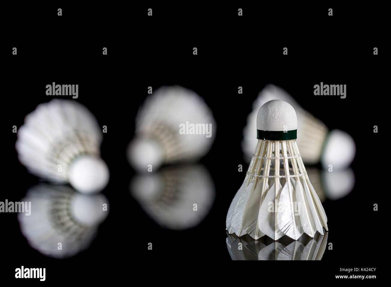 Feathered White Shuttlecock on Black background Stock Photo - Alamy
