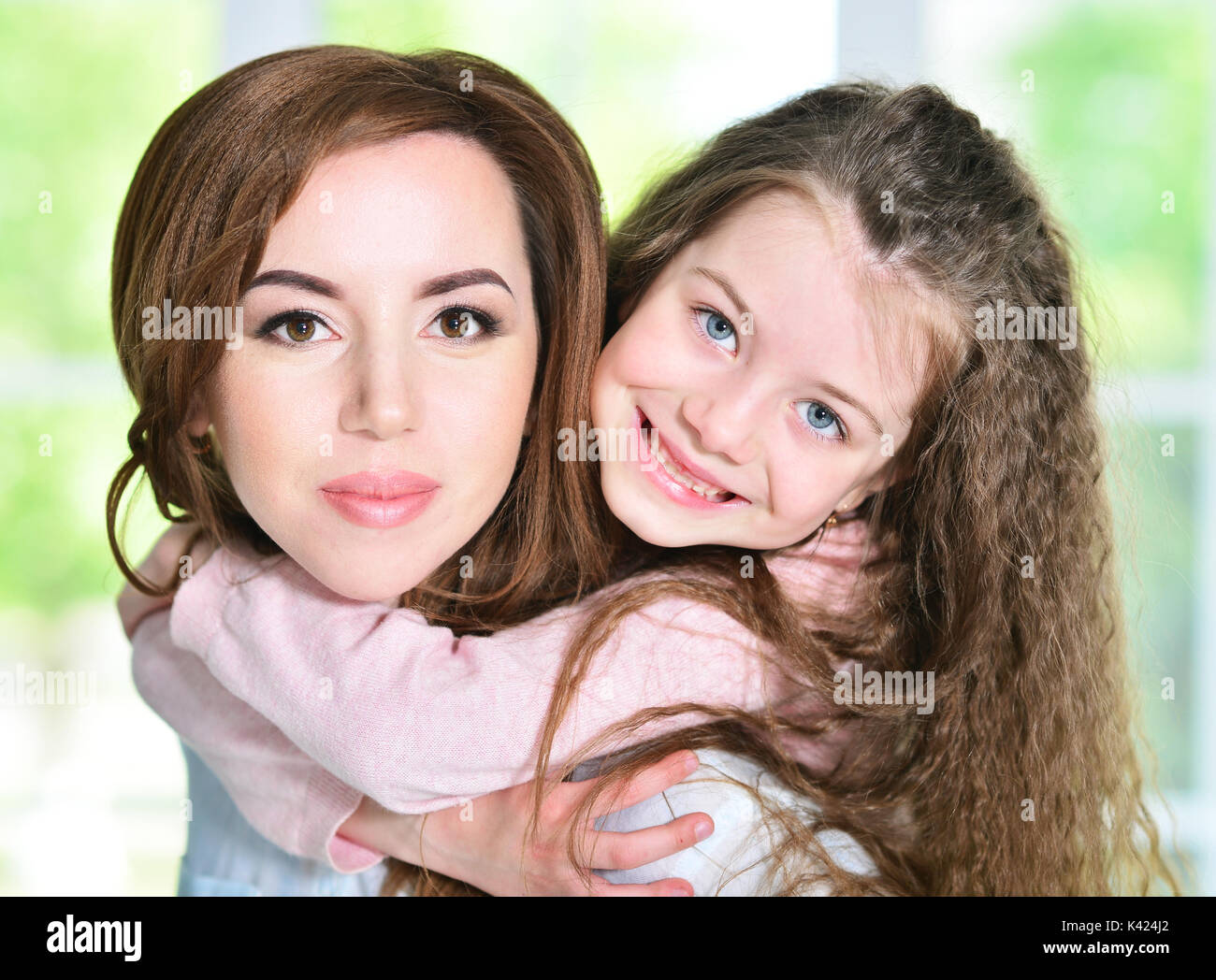 Girl hugging mother hi-res stock photography and images - Alamy